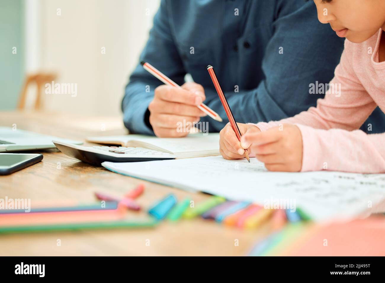 Dad is always there to help. an unrecognizable little girl doing her ...