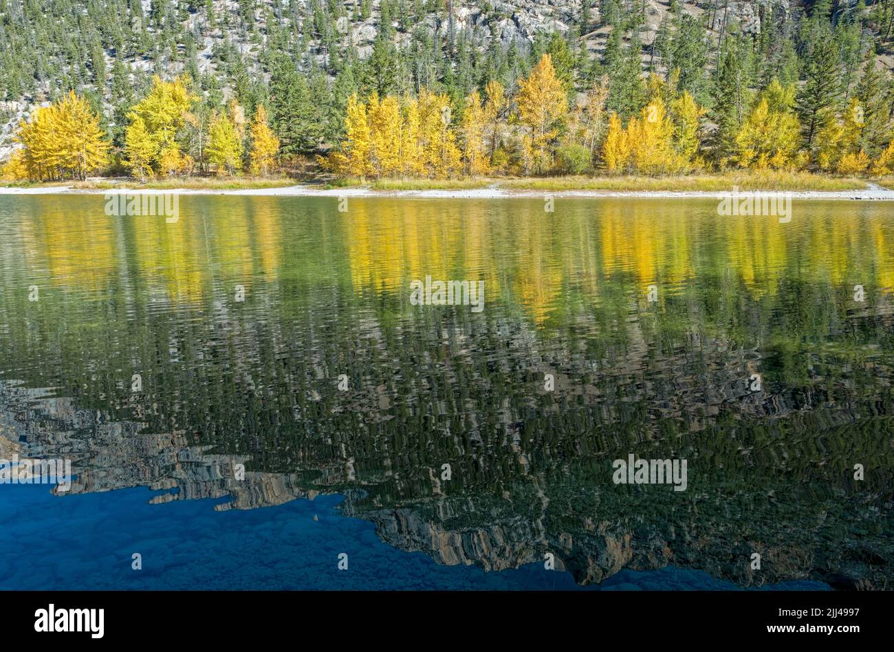 Reflected mountains in the waters of Crown Lake at Marble Canyon ...