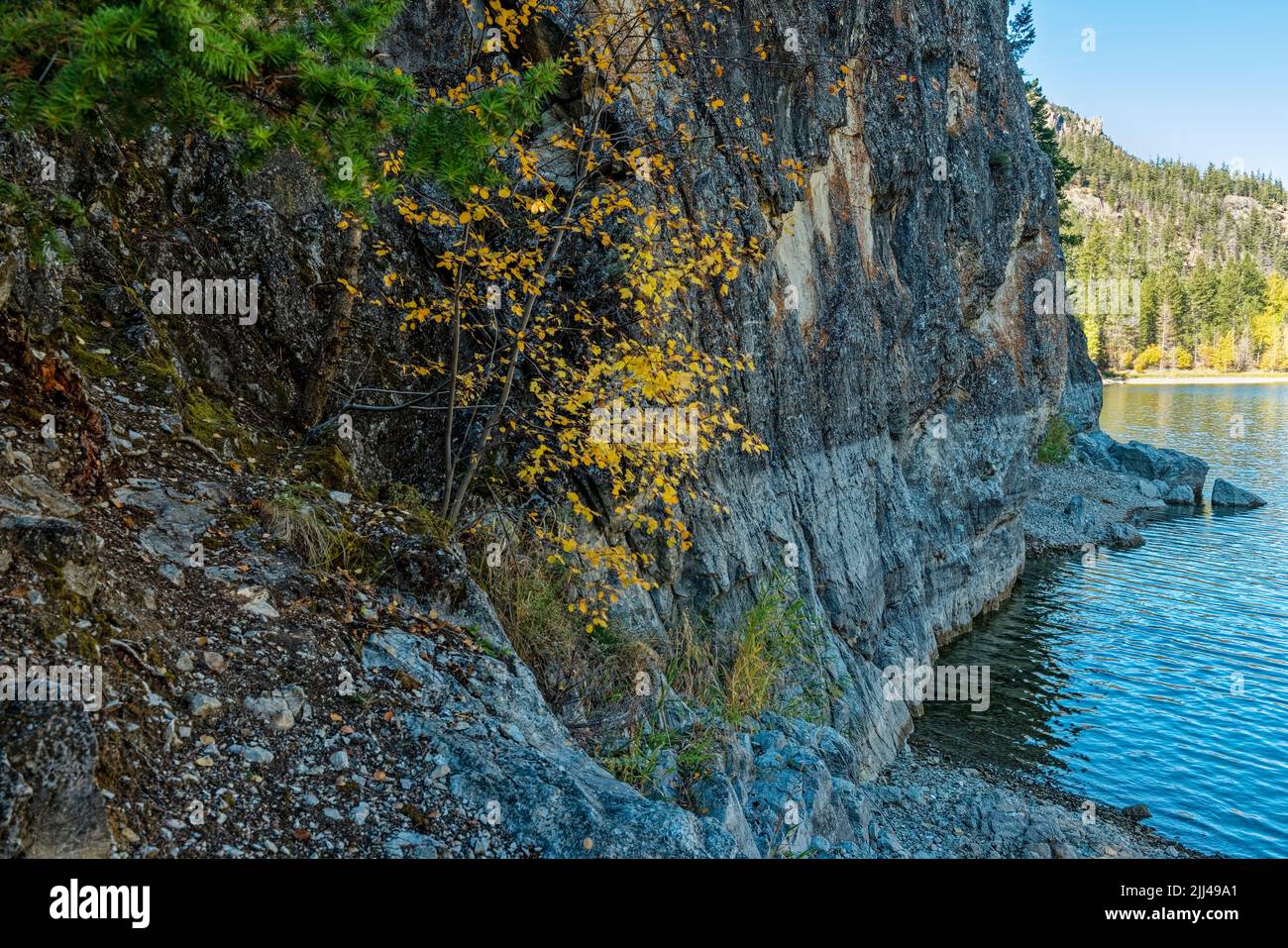 Rocky cliffs abut Crown Lake at Marble Canyon Provincial Park, British ...