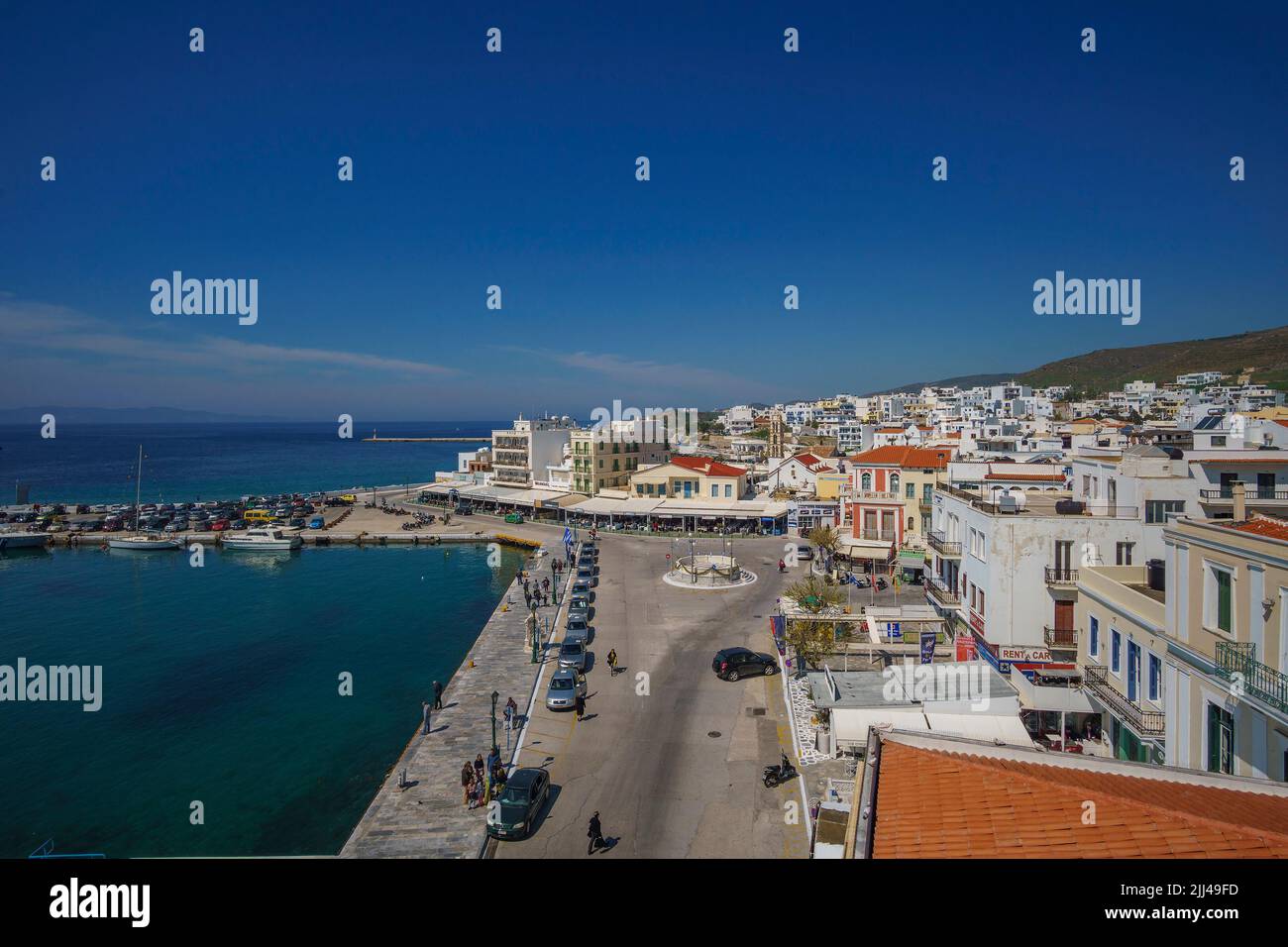 Urban view of Chora town in Tinos island around the port of Tinos in ...