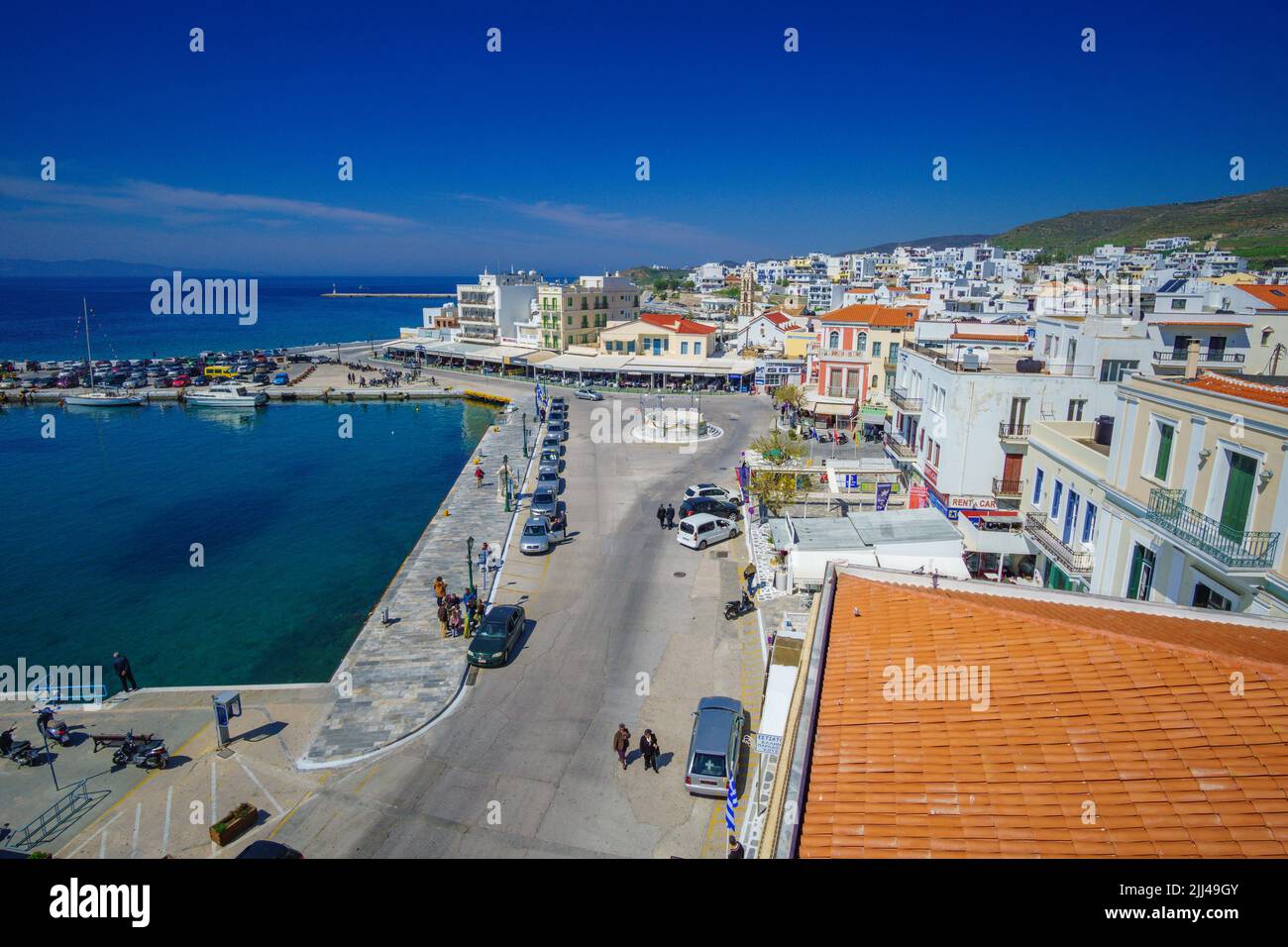 Urban view of Chora town in Tinos island around the port of Tinos in ...