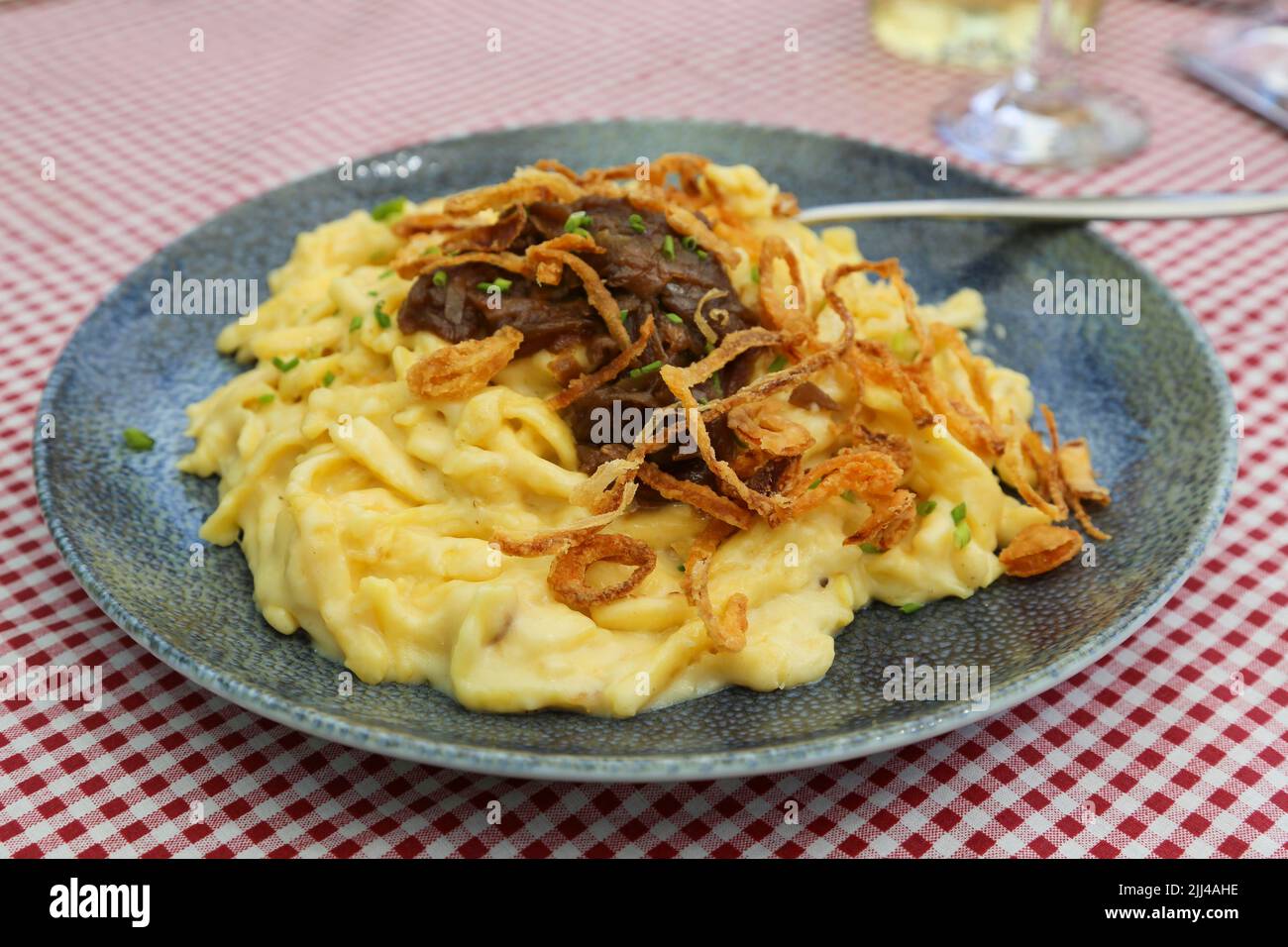 Swabian cuisine, cheese spaetzle with braised onions, traditional ...