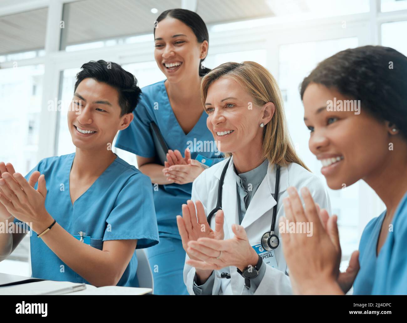 Every achievement deserves an applause. a group of doctors clapping ...