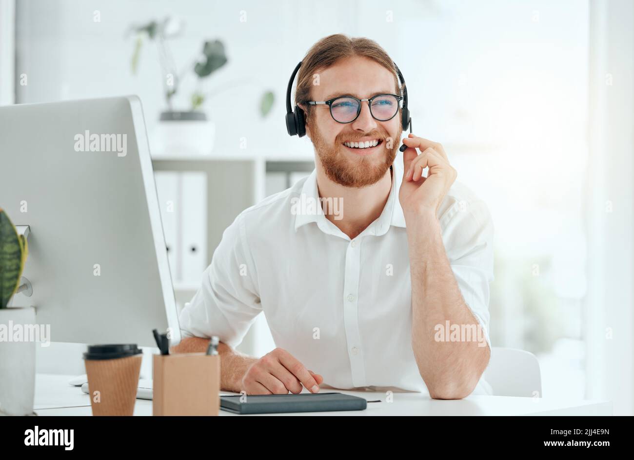 He makes every call a priority. a handsome young male call center agent ...