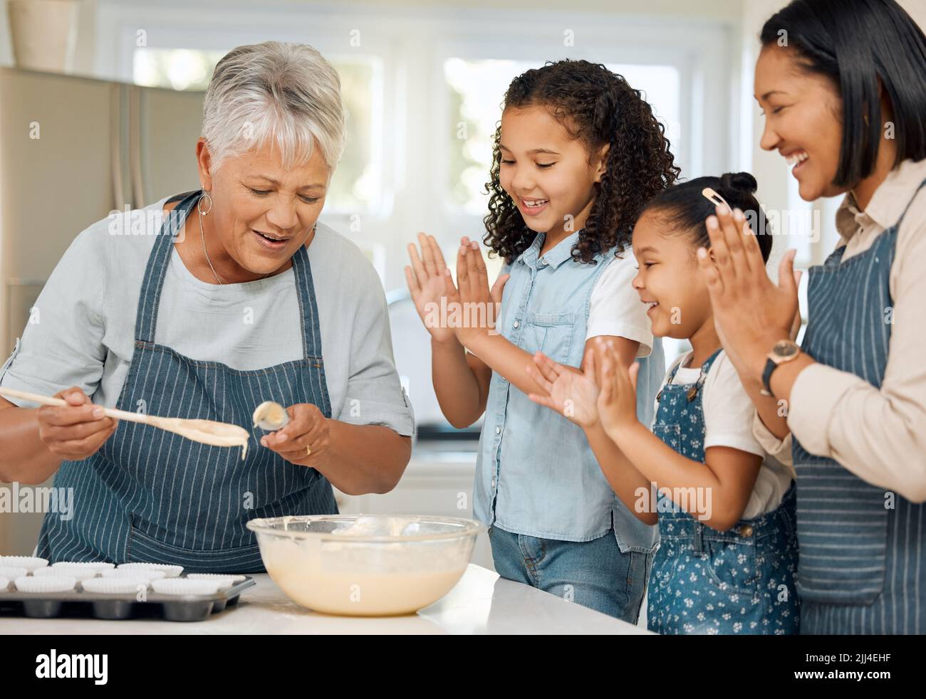 Gran is the expert at baking. a multi-generational family baking ...