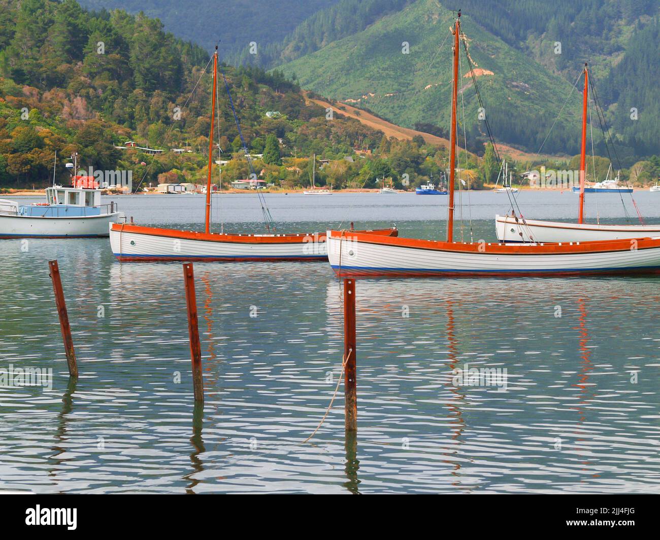 Scenic Kenepuru Sound images clinker sailing boats with masts moored ...
