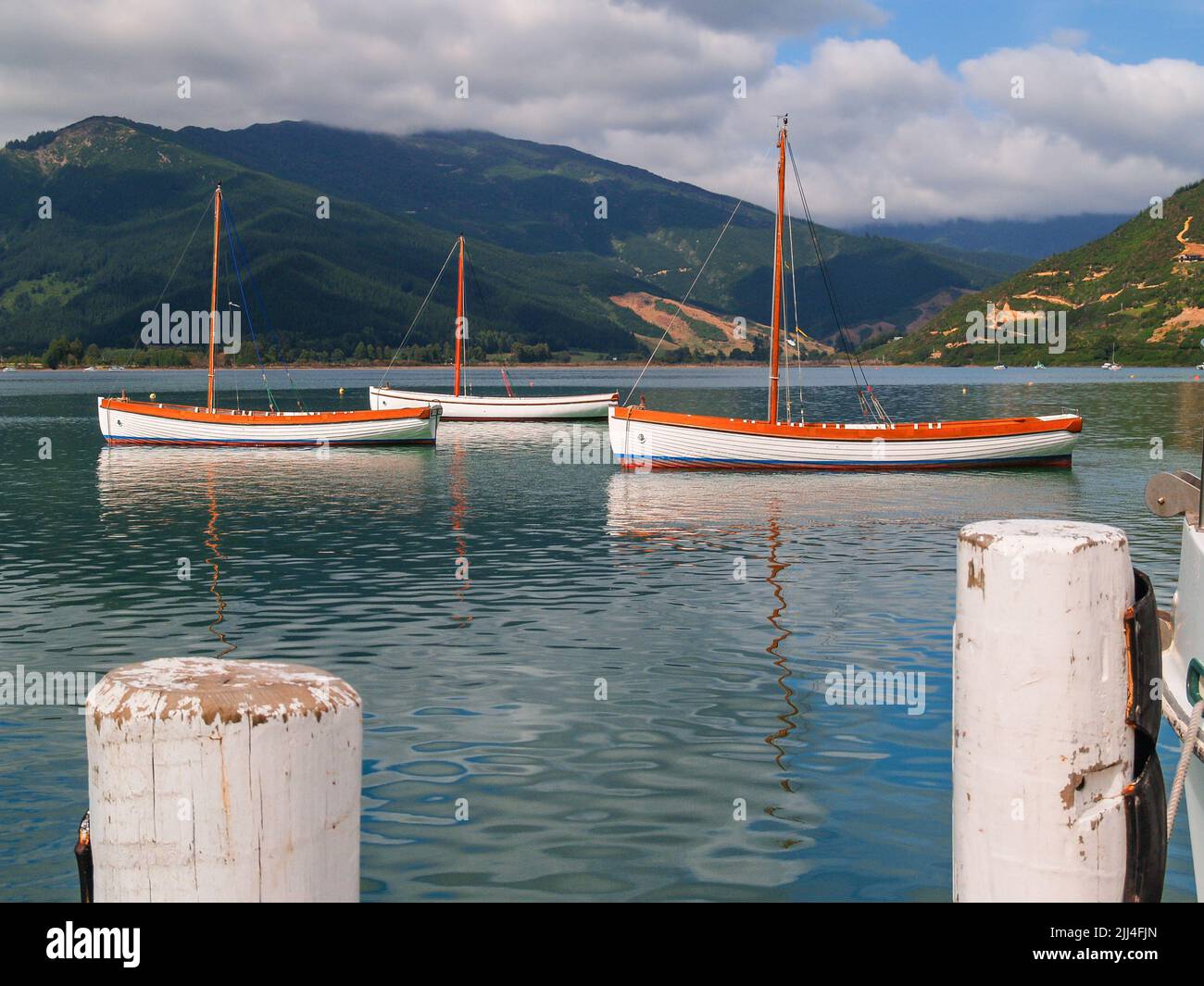 Scenic Kenepuru Sound images clinker sailing boats with masts moored ...