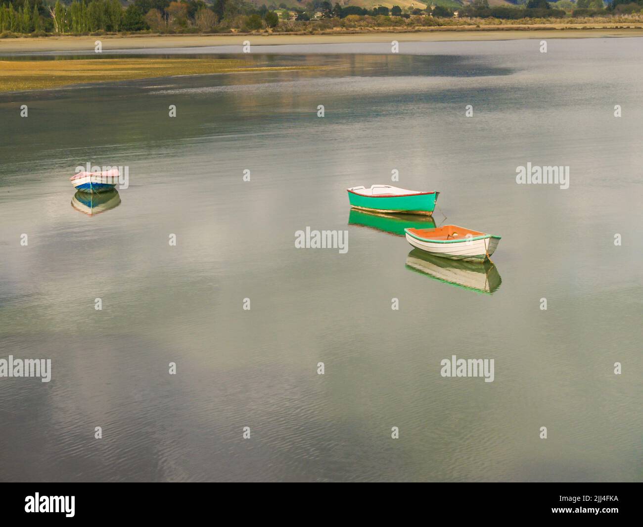 Scenic Kenepuru Sound images of water's edge and three dinghy boats ...