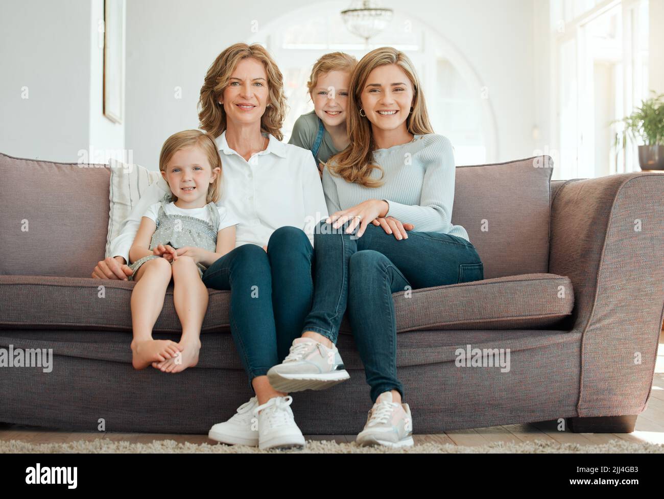 Three generations. Full length shot of two adorable little girls ...