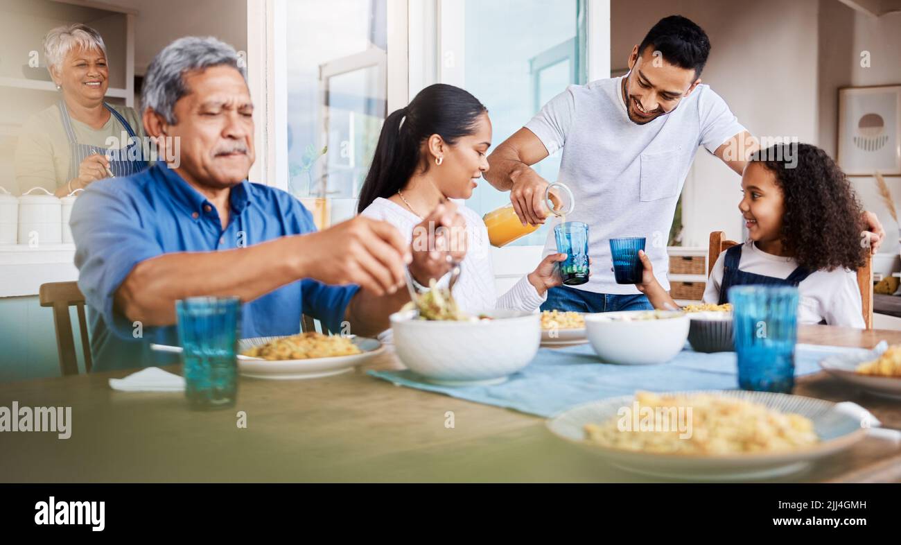 Sundays are for family lunches. a happy family having lunch together at ...