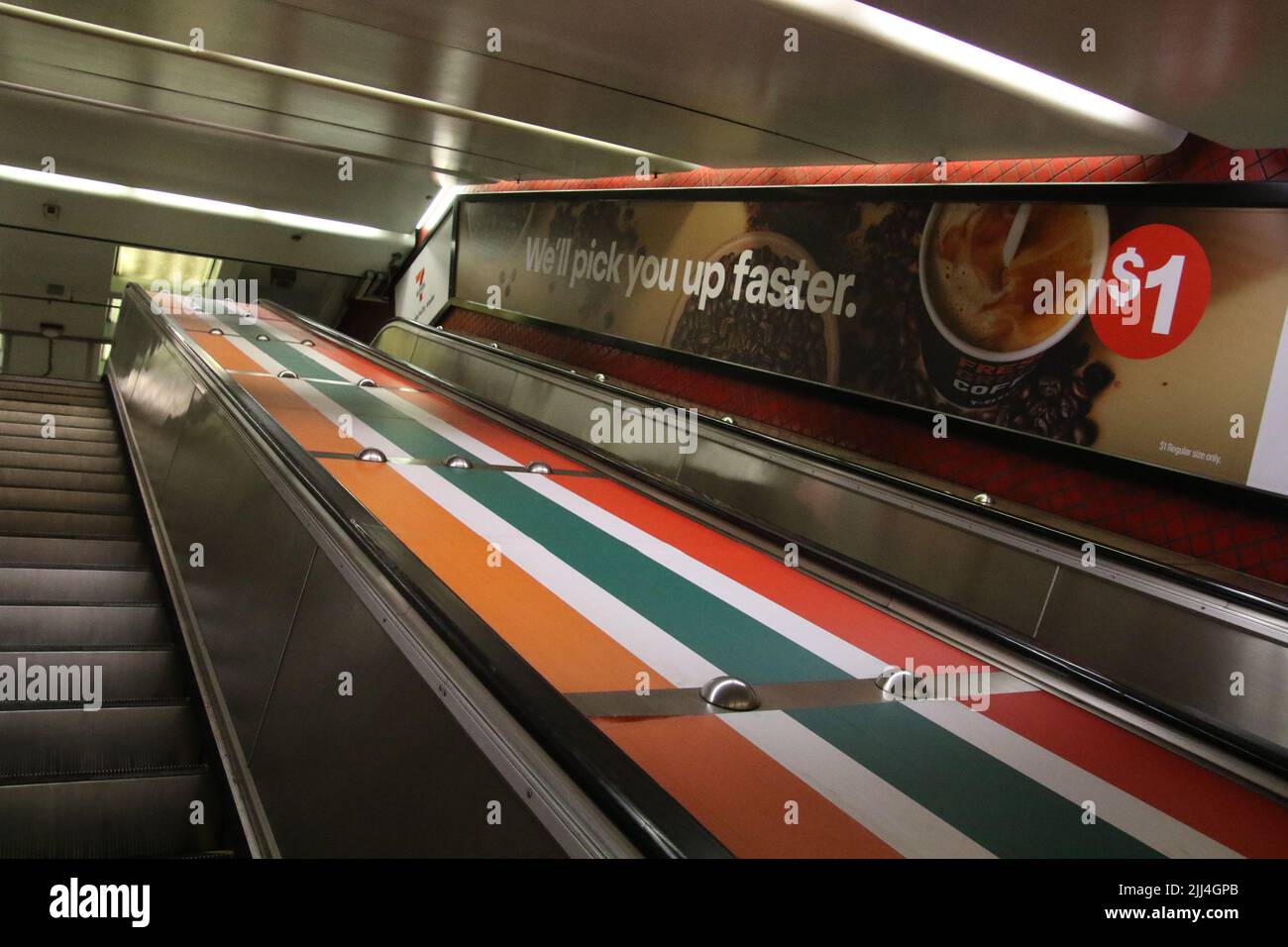 7 Eleven adverts alongside the escalators at Martin Place train station ...