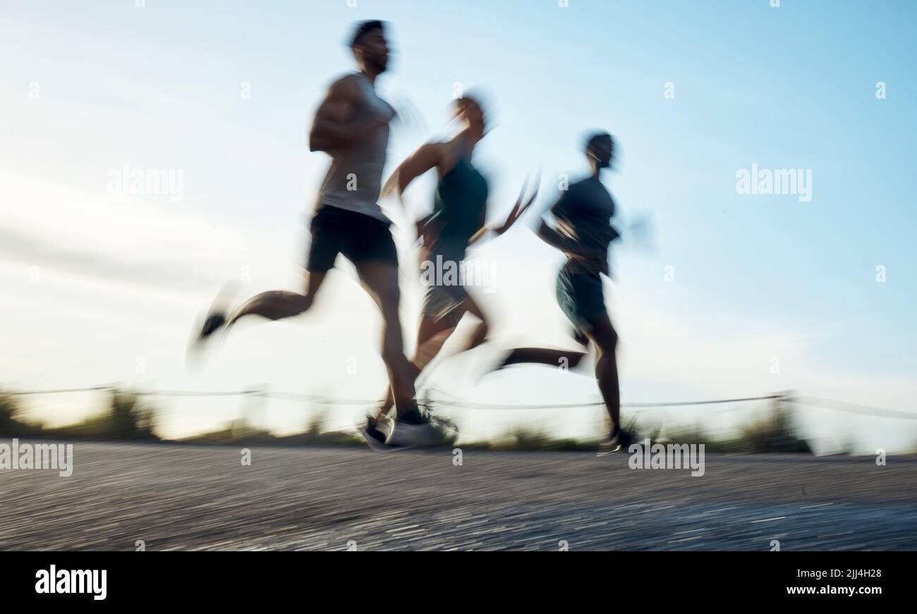 Three running men hi-res stock photography and images - Alamy