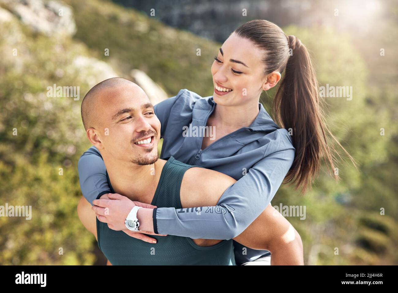 Ill carry you back. a man carrying his girlfriend on his back while out ...