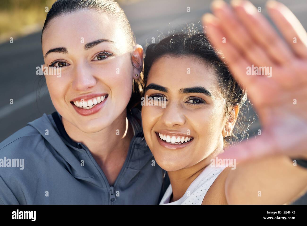 We want to encourage others. two young women out for a run together ...