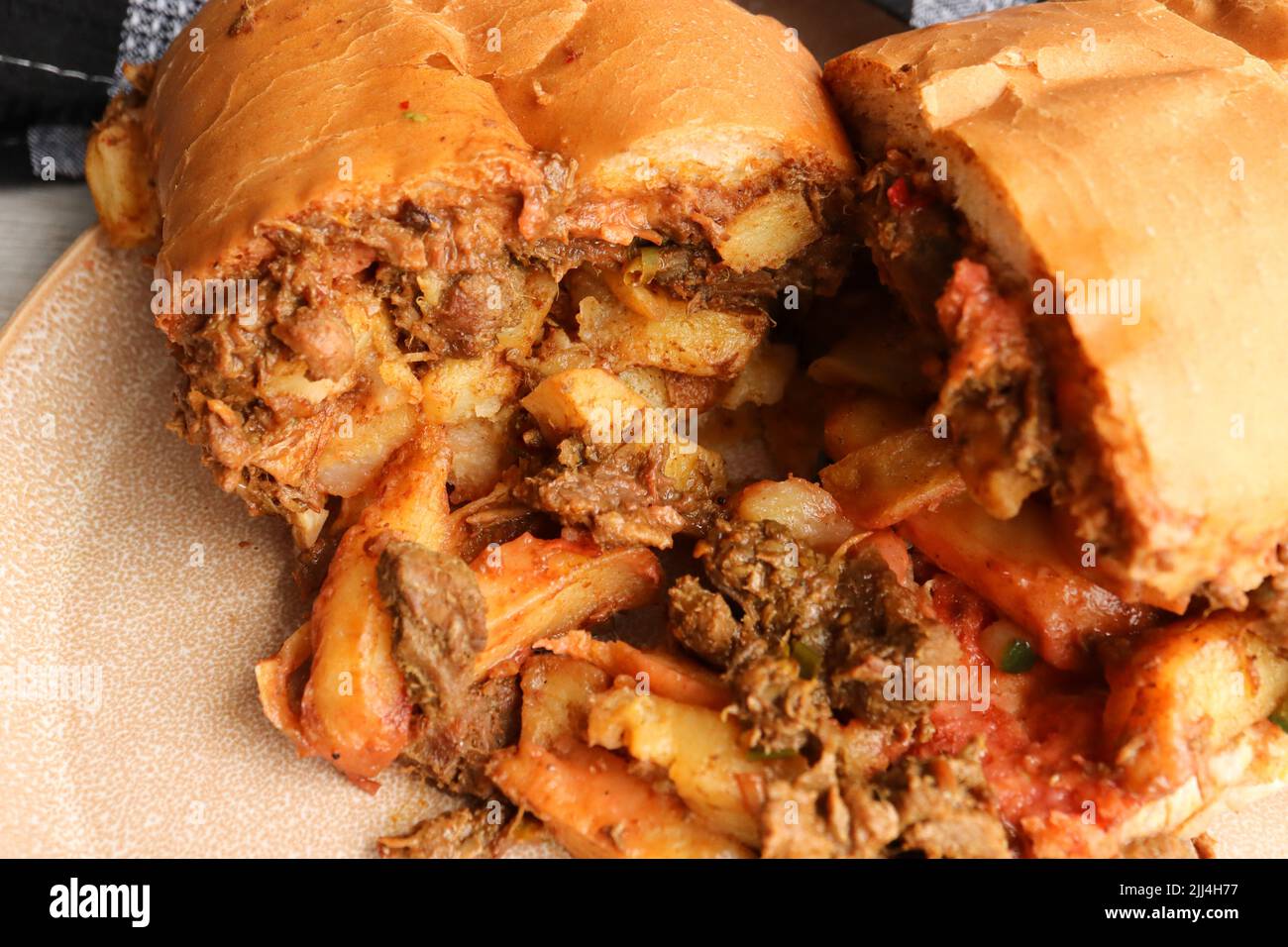 Masala steak gatsby. Traditional South African fast food. Roll with ...