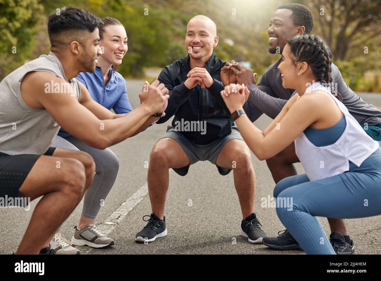 Take charge and make a change. a group of sporty young people doing ...
