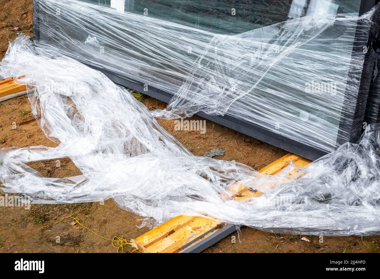new upvc windows wrapped in cellophane unpacking outdoor Stock Photo ...