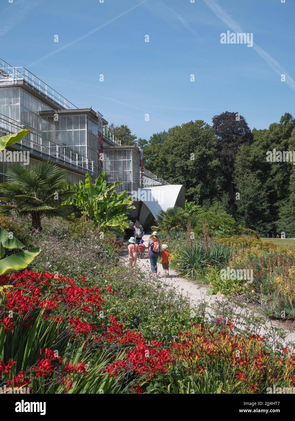 People with children walking through the royal national botanic garden ...