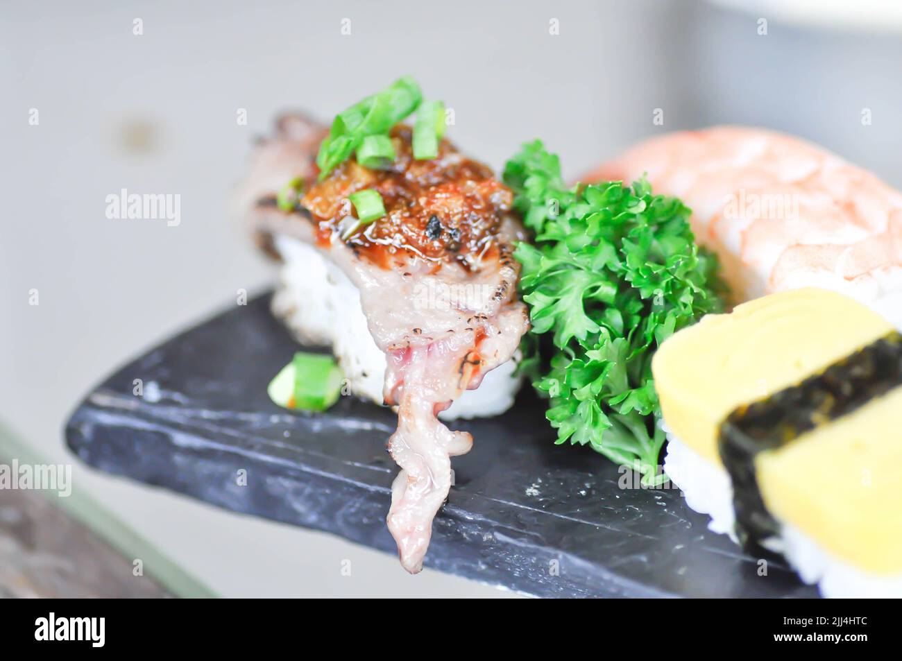 sushi or gyuuniku sushi , rice topped with raw beef or beef sushi and ...