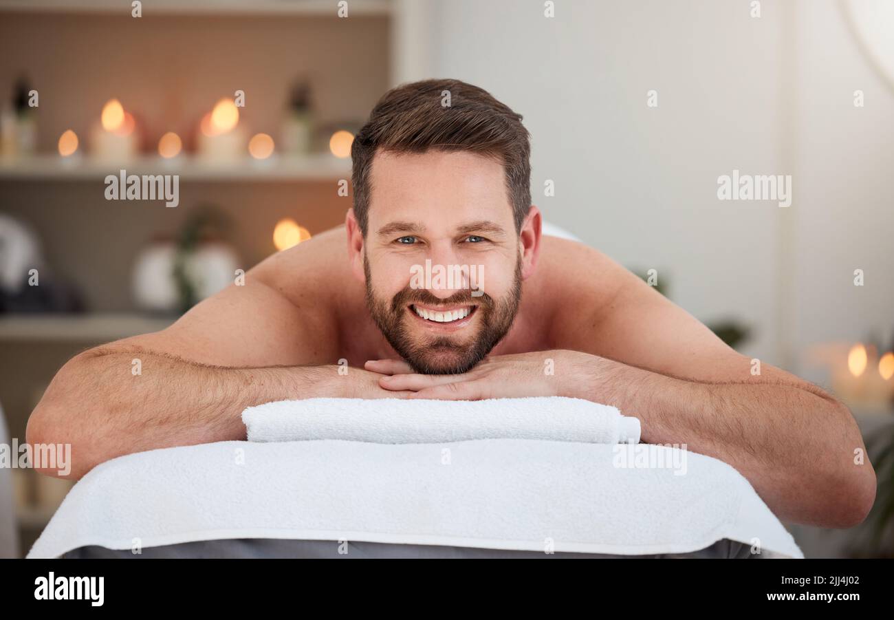 Happiness is massage day. a male relaxing on a bed in a spa Stock Photo ...