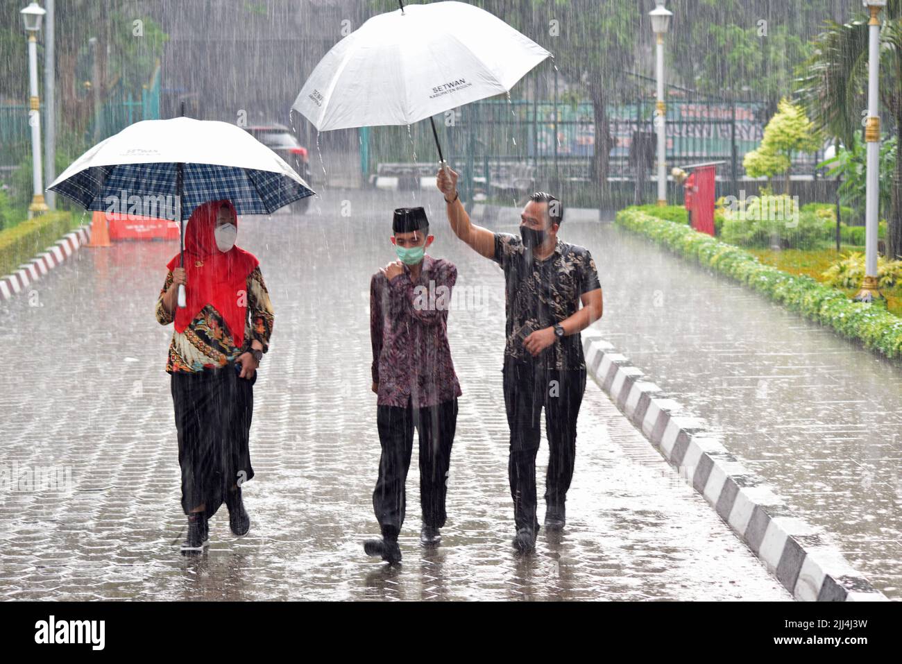 Deputy Chairperson of the Bogor Regency DPRD, Agus Salim (center) walks ...