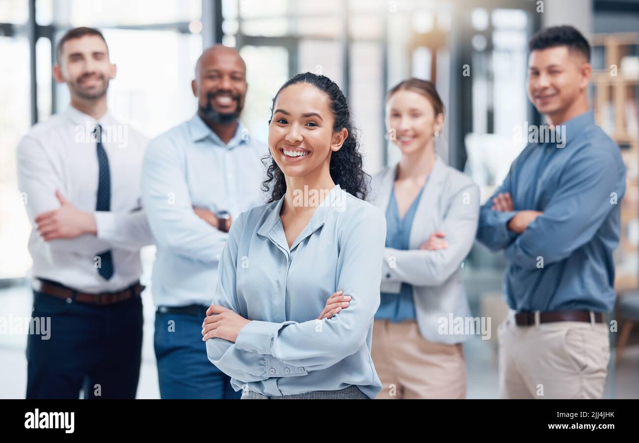 Theres nothing we cant do. a group of businesspeople standing with ...