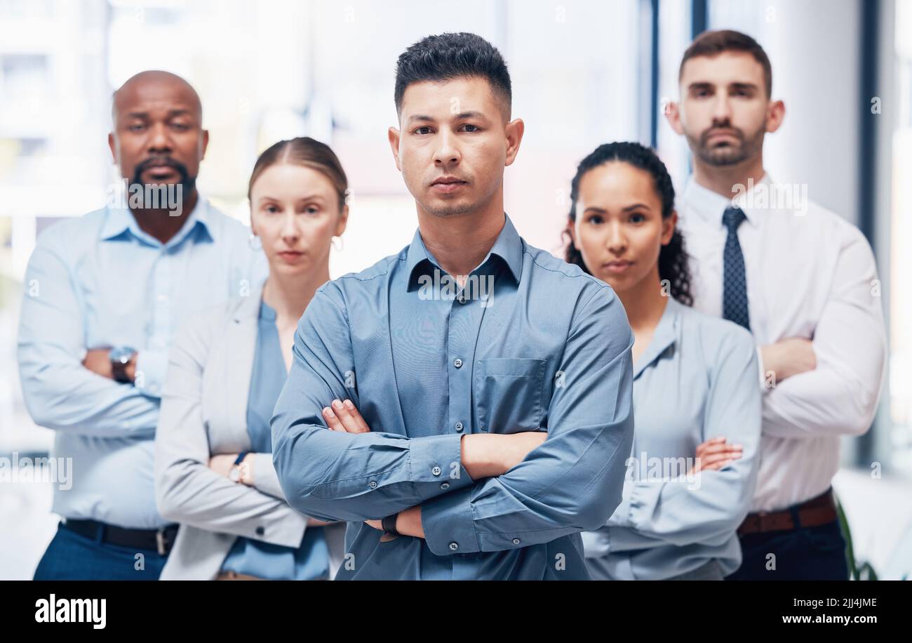 We dont take our business lightly. a group of businesspeople standing ...