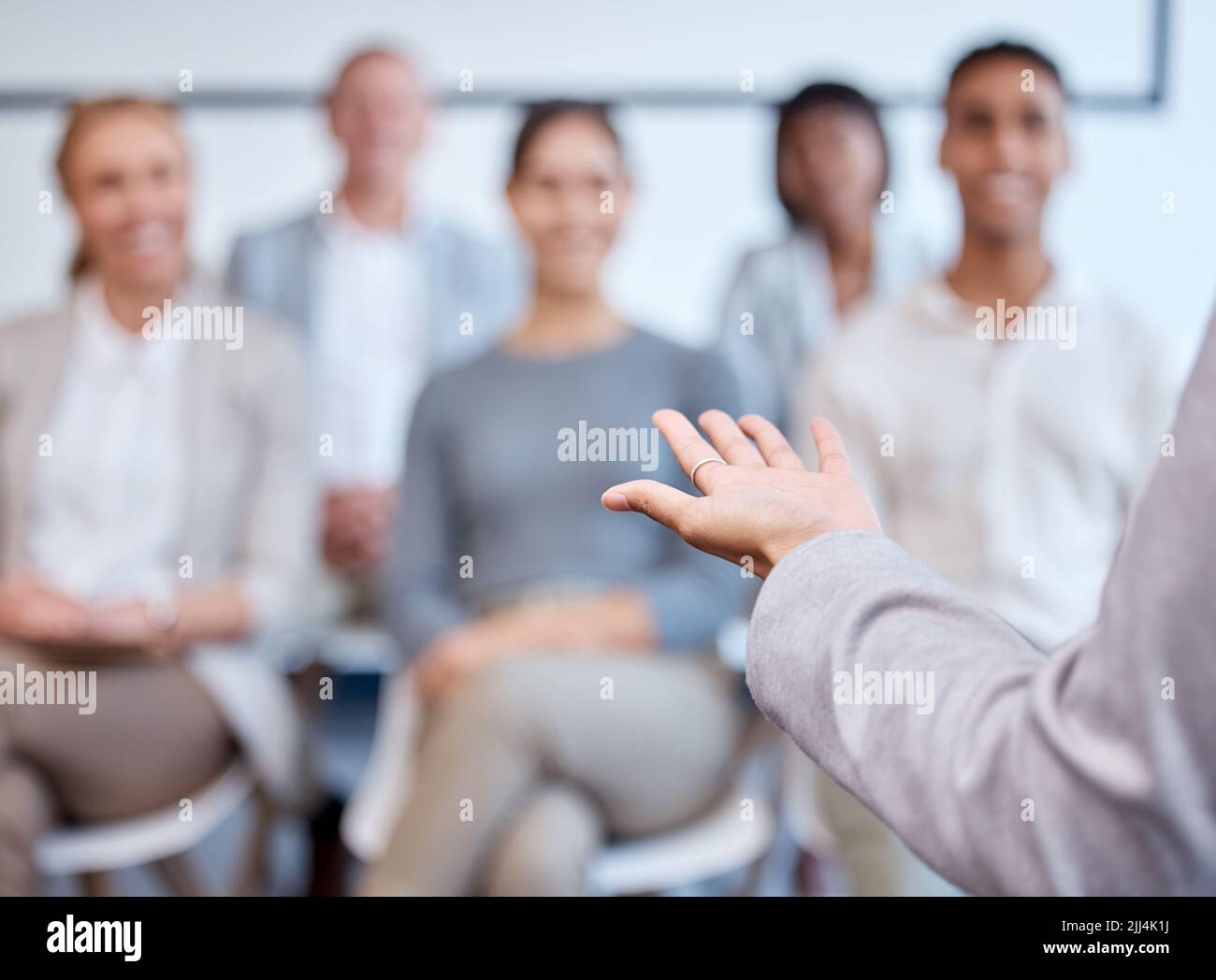 Shes got their full attention. an unrecognizable businesswoman giving a ...