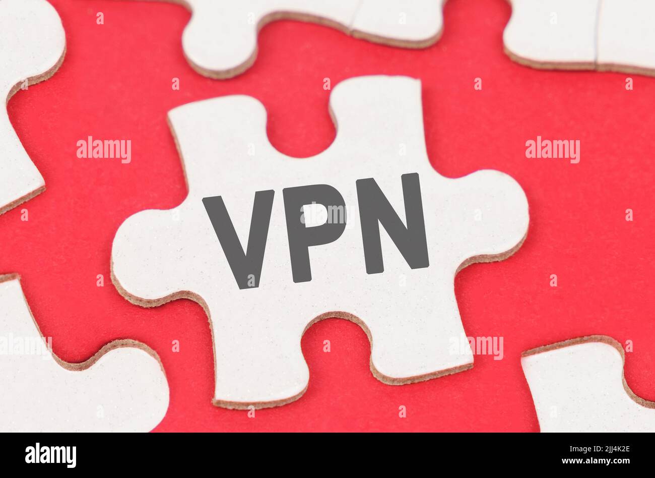 Internet and security. On a red background, among white puzzles lies a ...