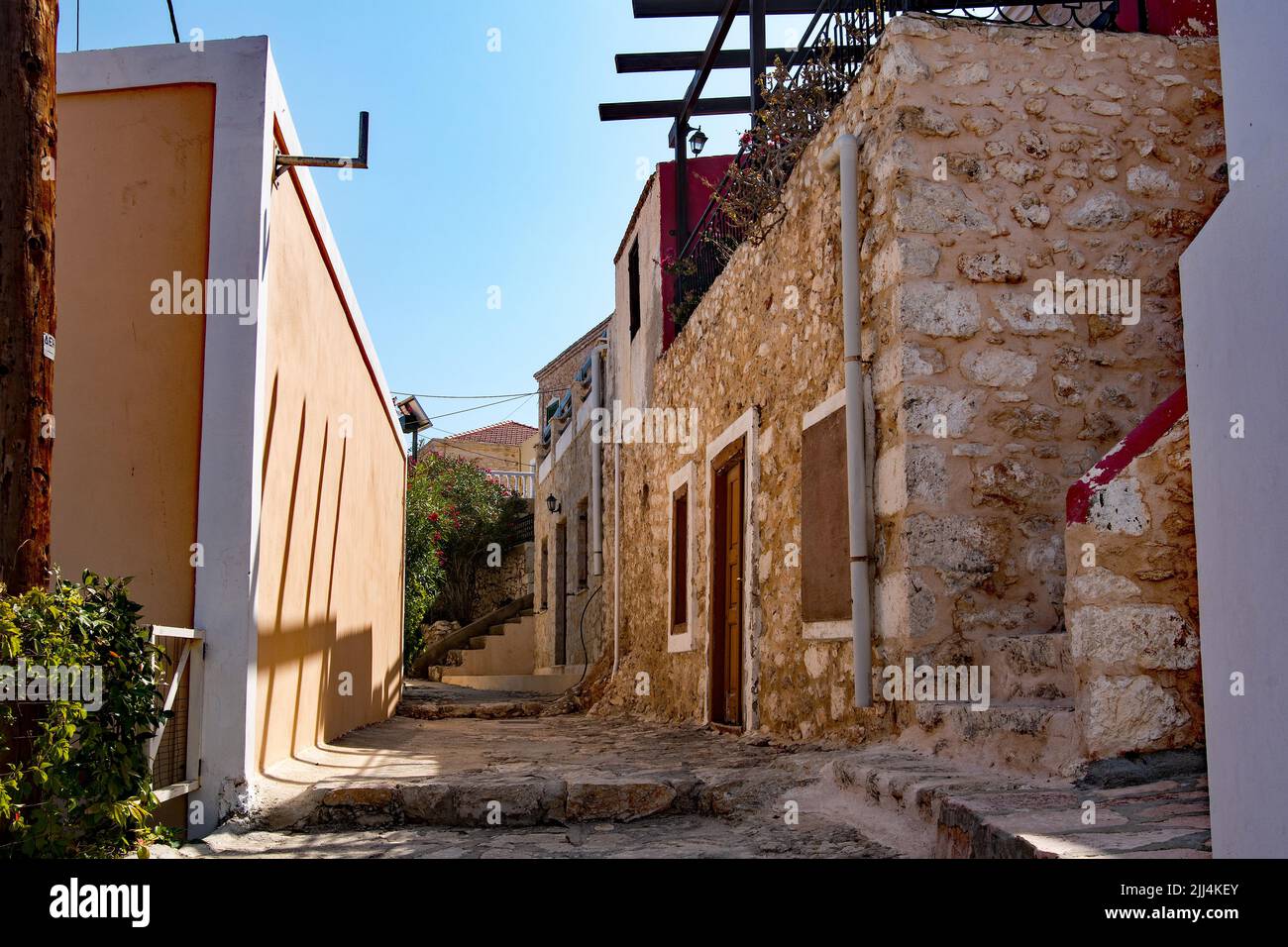A charming street of a traditional Greek fishing village on the island ...