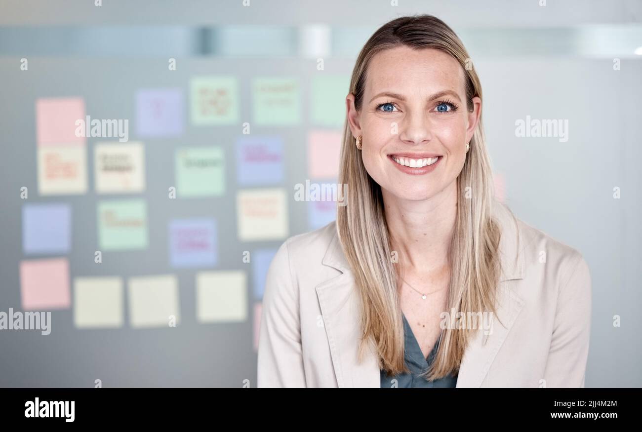 Happy to answer any of your questions. Portrait of a businesswoman with ...