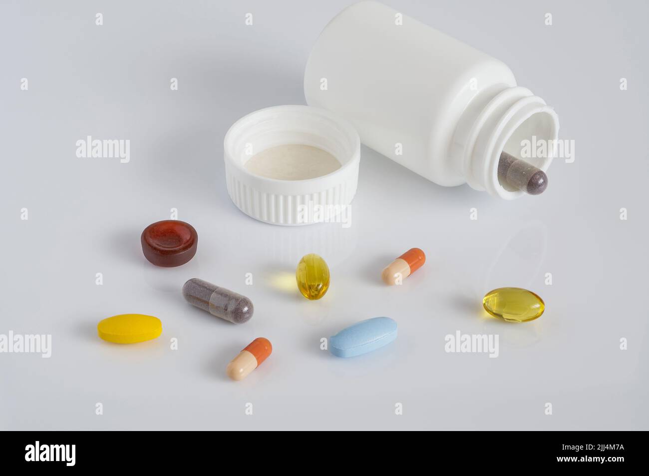 pills, vitamins, pills, jelly beans, white bottle for drugs, on a white ...