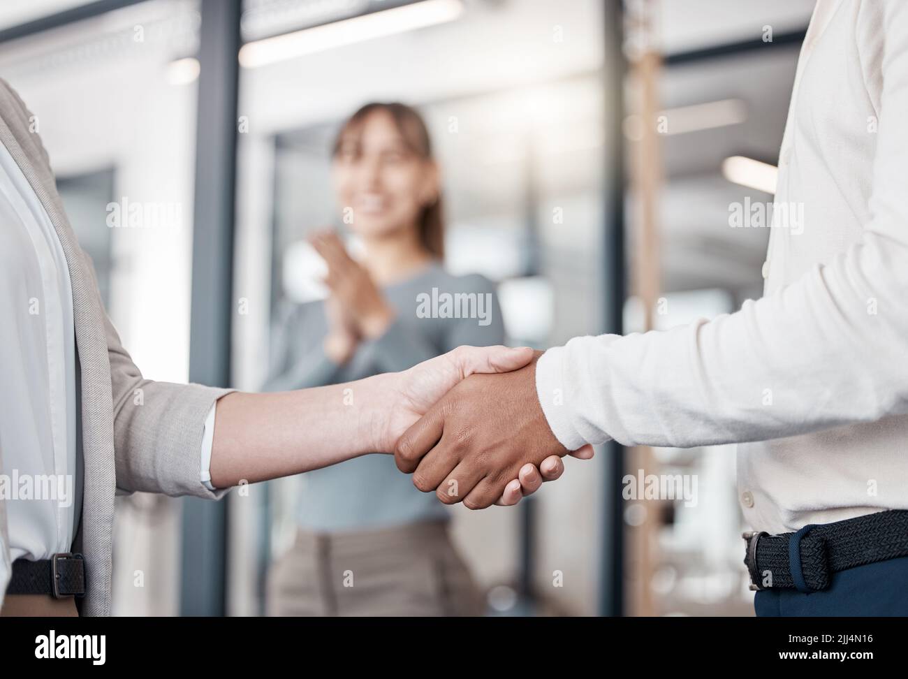 Were going to do great things. two unrecognizable businespeople shaking ...