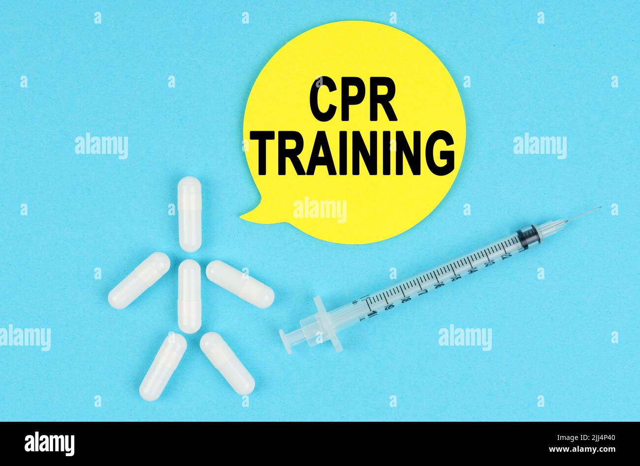 Medicine and health concept. Syringe, human figure made of pills and ...