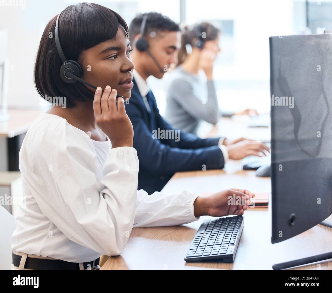 Work harder and youll get what you want. a young businesswoman working ...