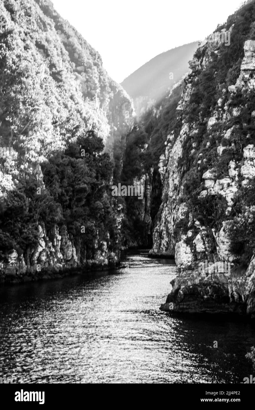 The morning light shinning into the steep ravine at stormsriver mouth ...
