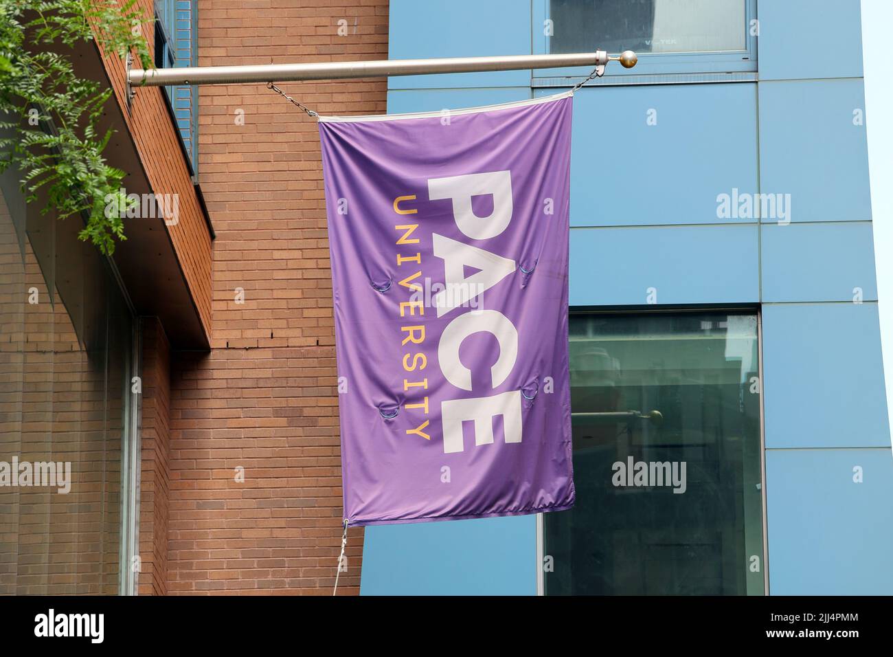 A Pace University lavender colored school flag on a building in Lower ...