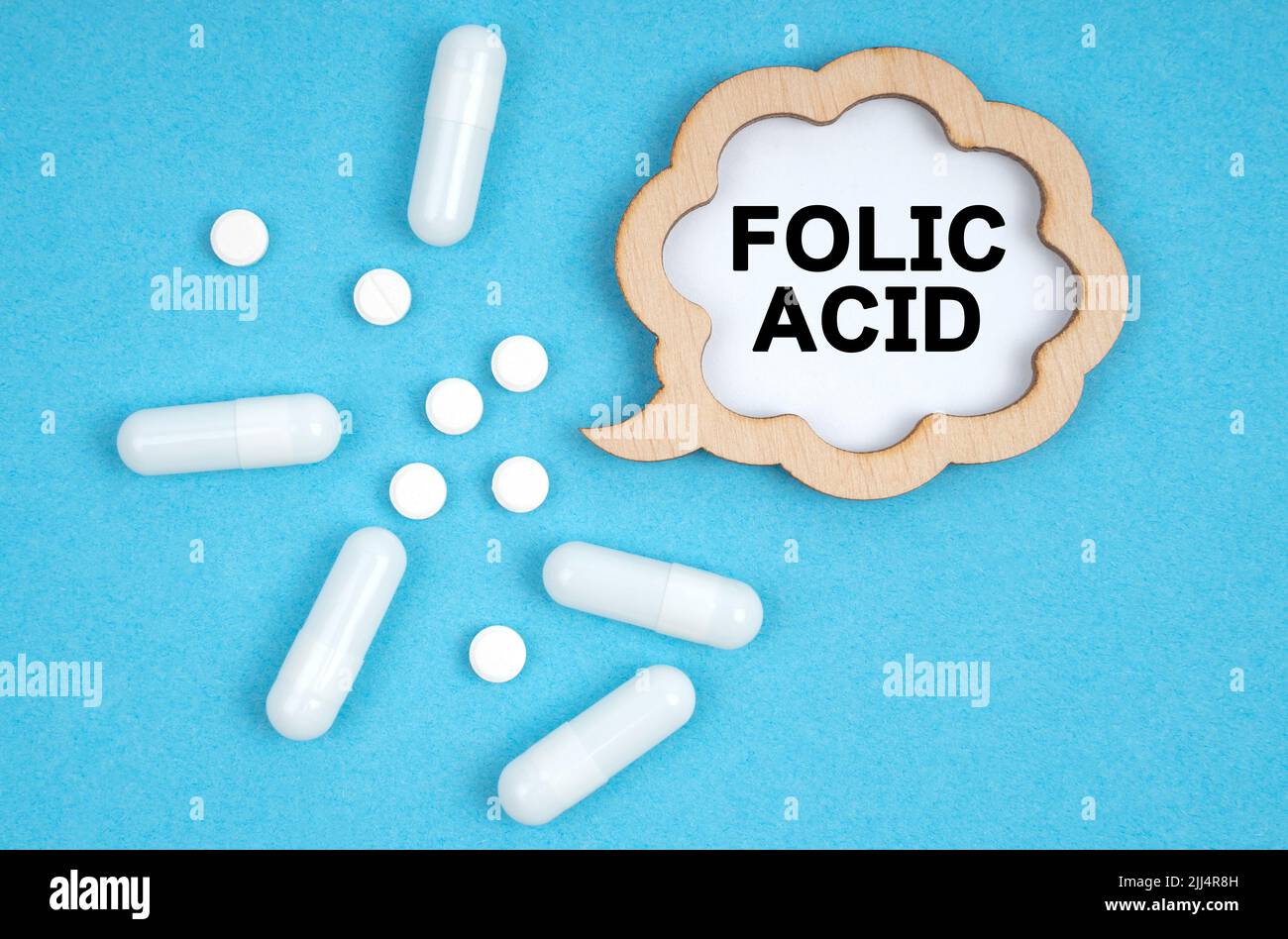 Medicine and health concept. On a blue background, pills and a plate ...