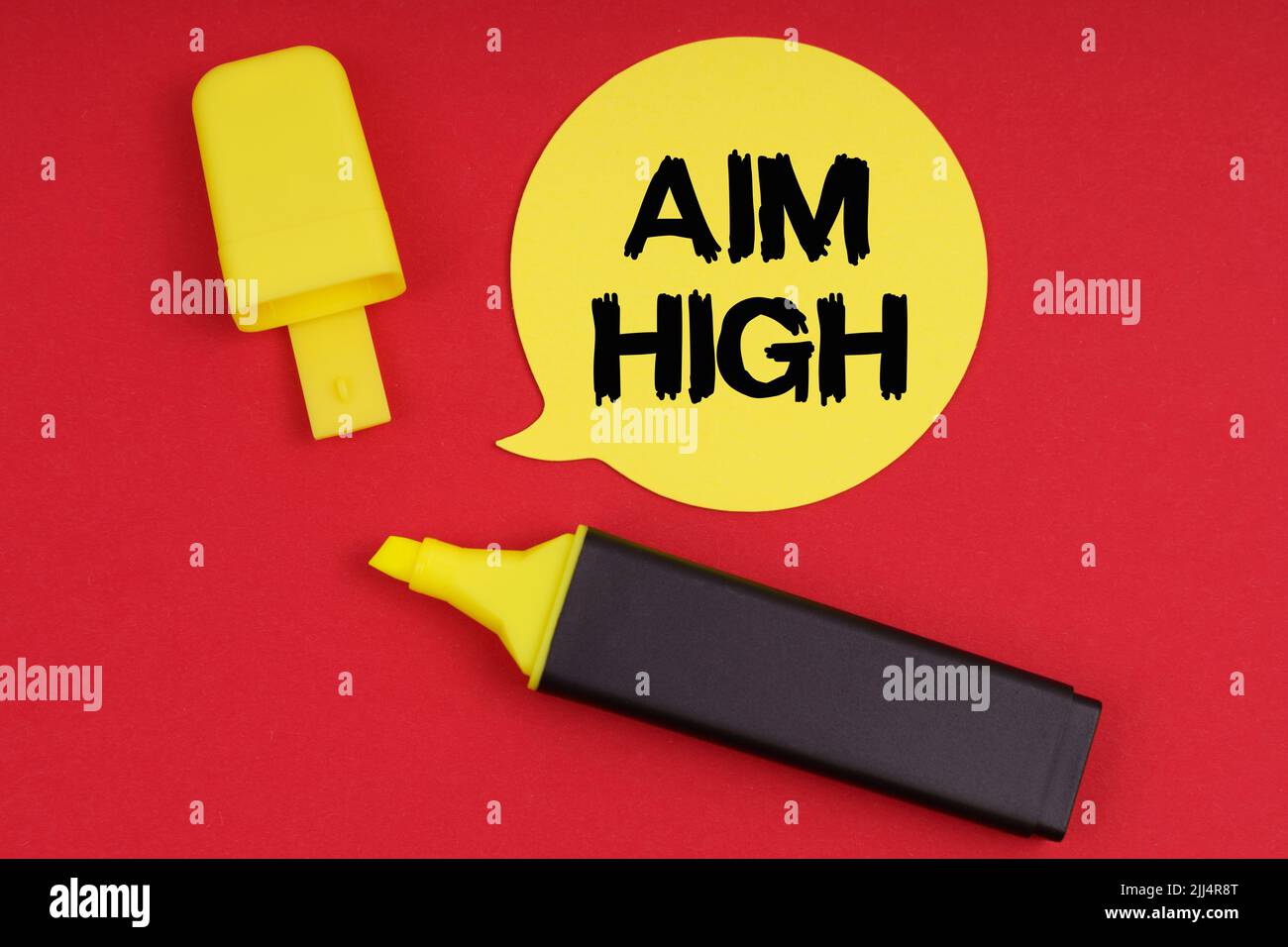Business concept. On a red background is a marker and a sticker with ...