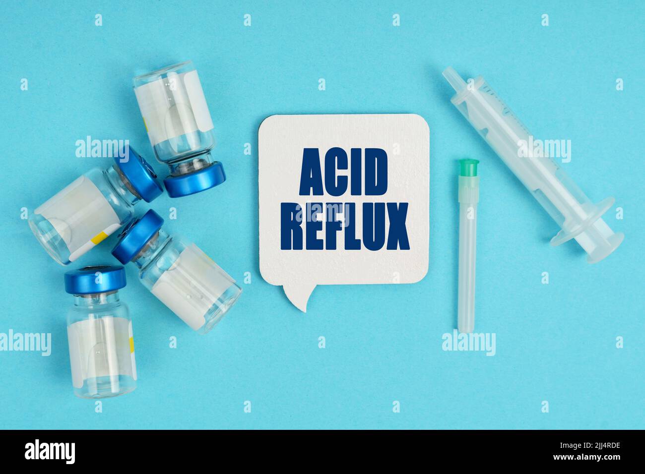 Medicine and health concept. On the table is a syringe, an injection and a white plaque ...