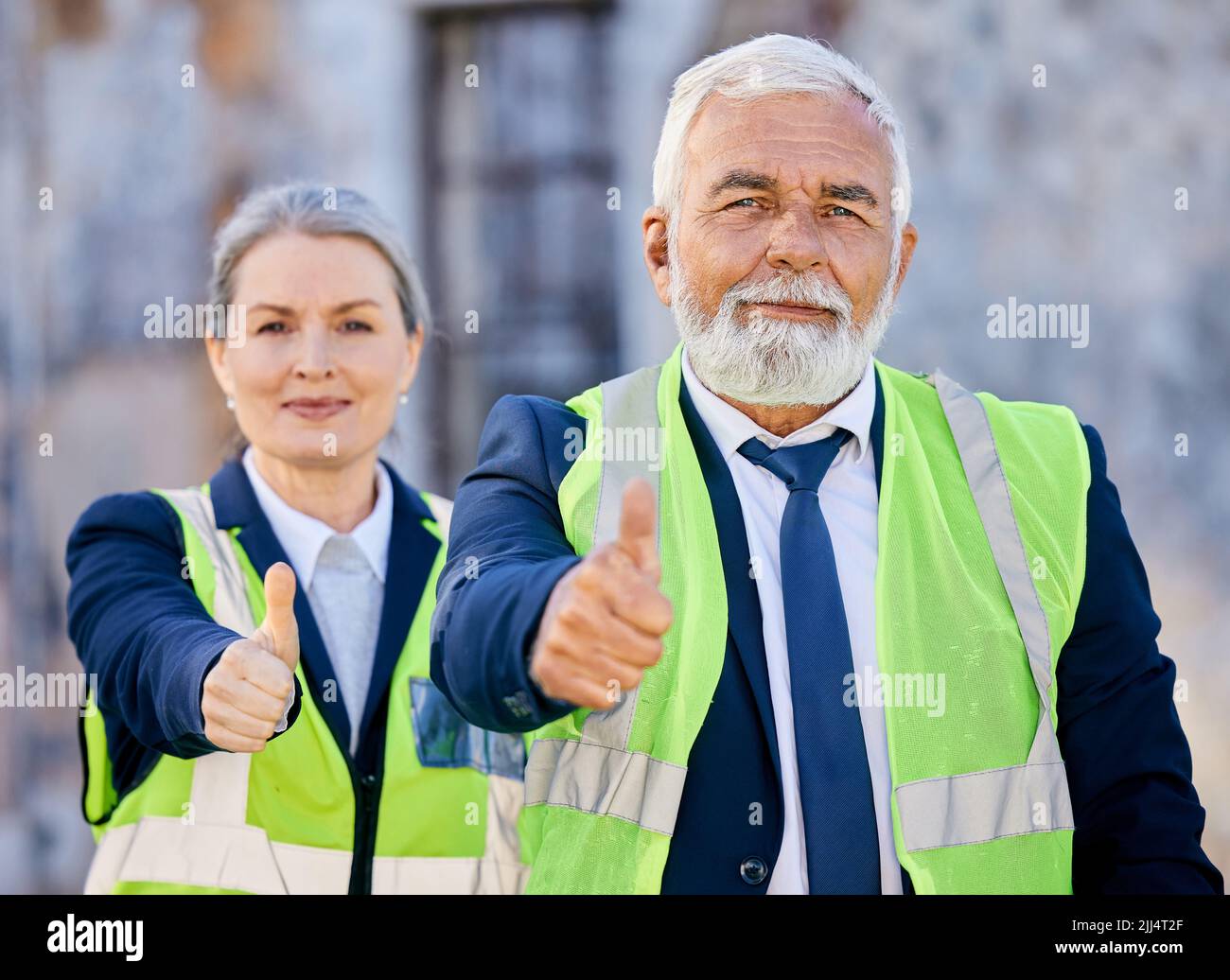 Always be the hardest worker in the room. two engineers giving thumbs ...