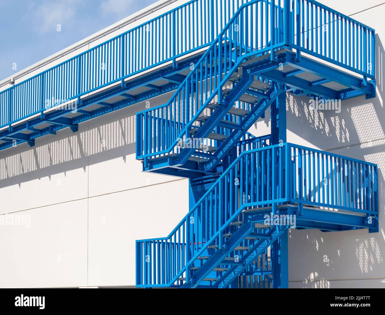 blue fire escape in an industrial building Stock Photo - Alamy