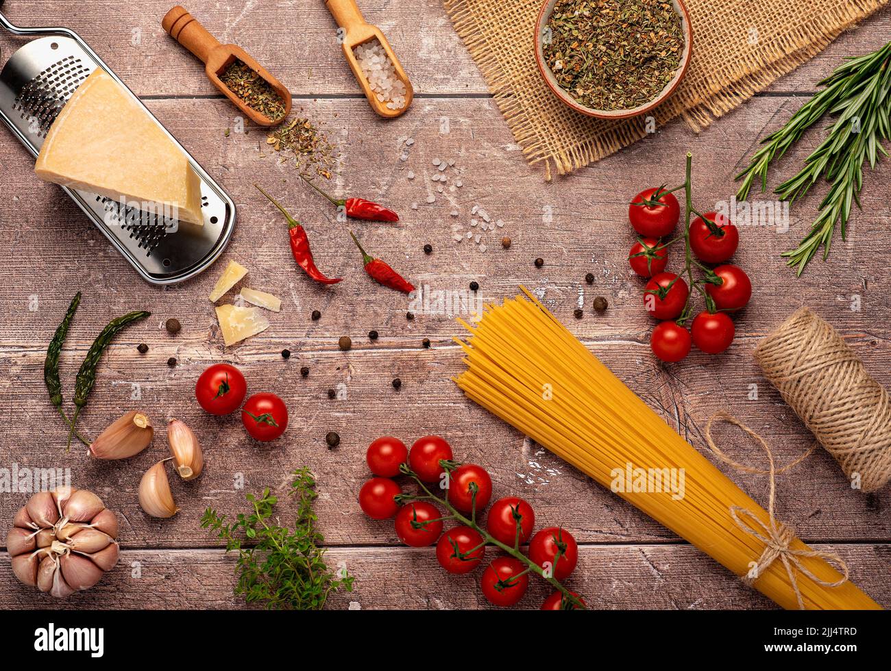 Flat lay photography of raw spaghetti; tomato; pasta; garlic ...