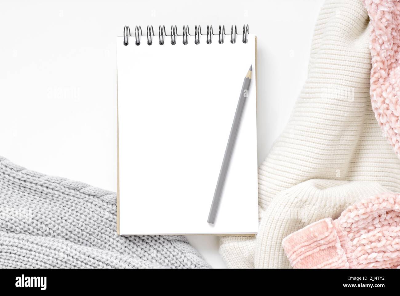 Home cozy mock-up. Template with a spiral notepad with a blank screen ...