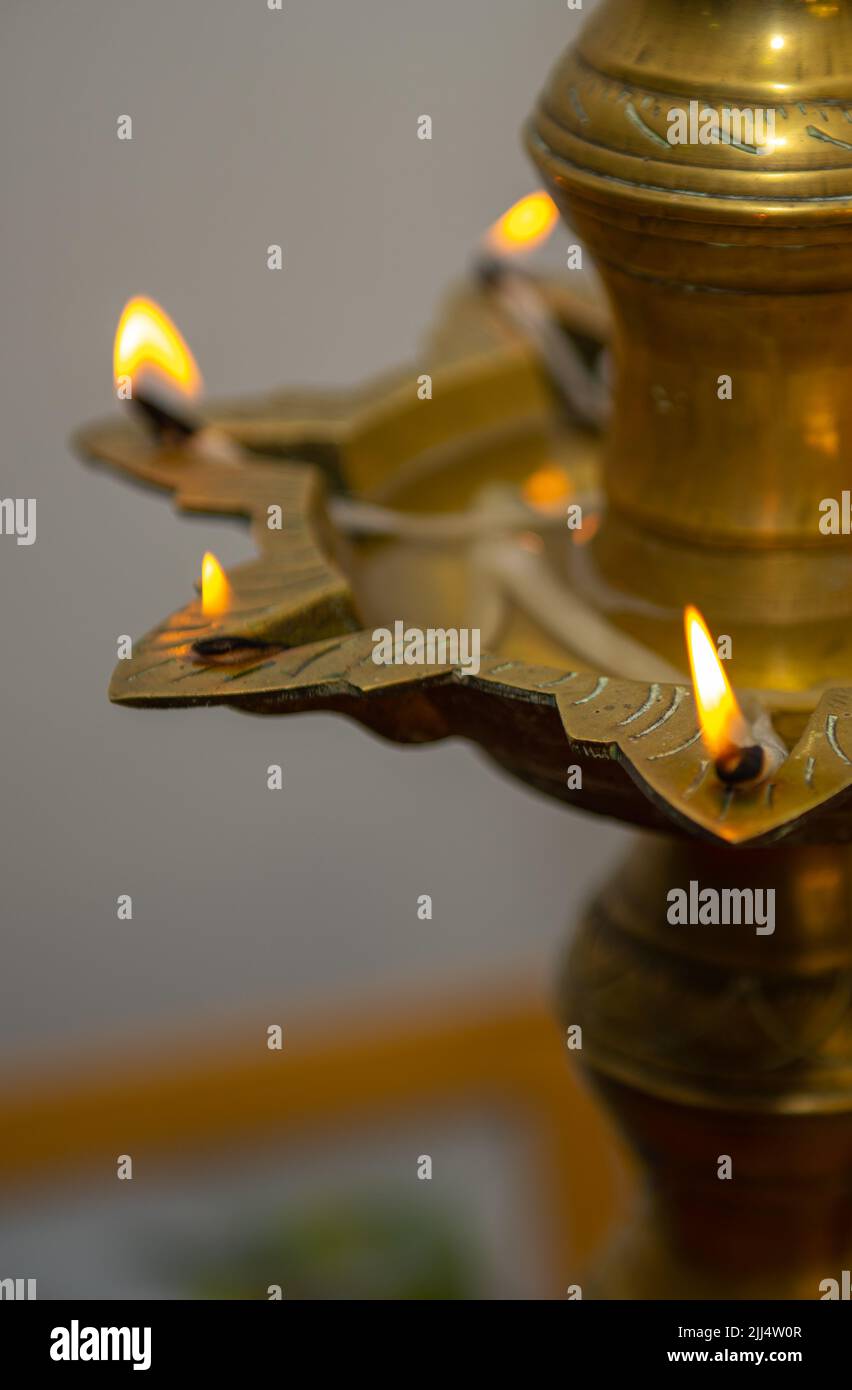 Brass Oil lamp illuminated before the opening ceremony close-up shot ...