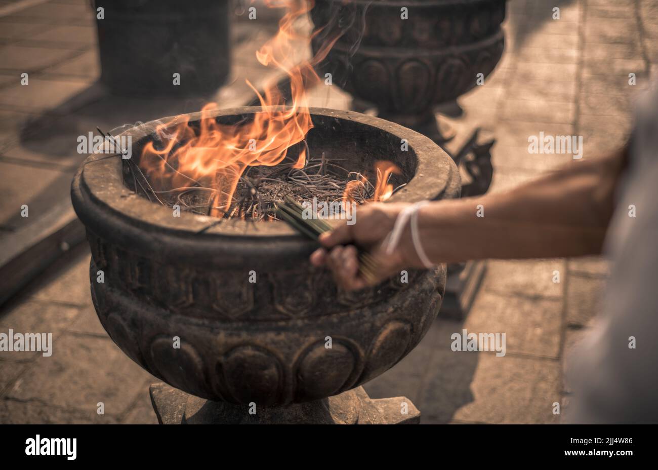 New incense sticks getting lit up by the woman's hand, Burning incense ...