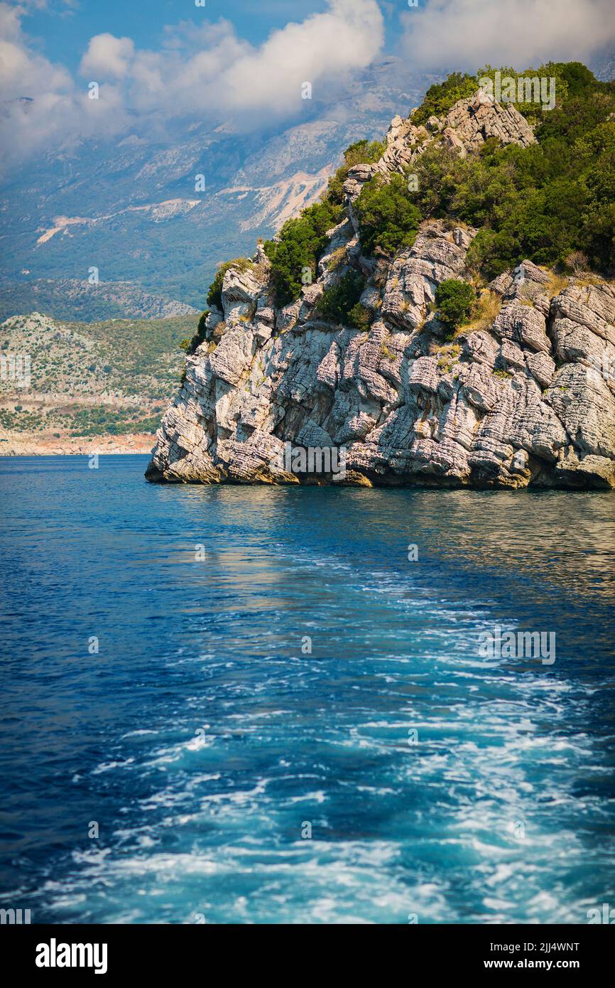 Wave trace tails of speed boat on blue water surface in the sea Stock ...