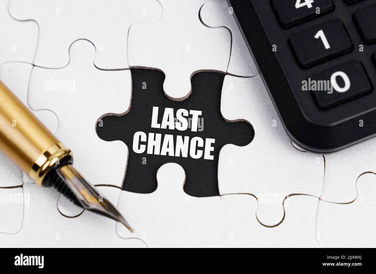 Business and finance concept. On white puzzles there is a calculator ...