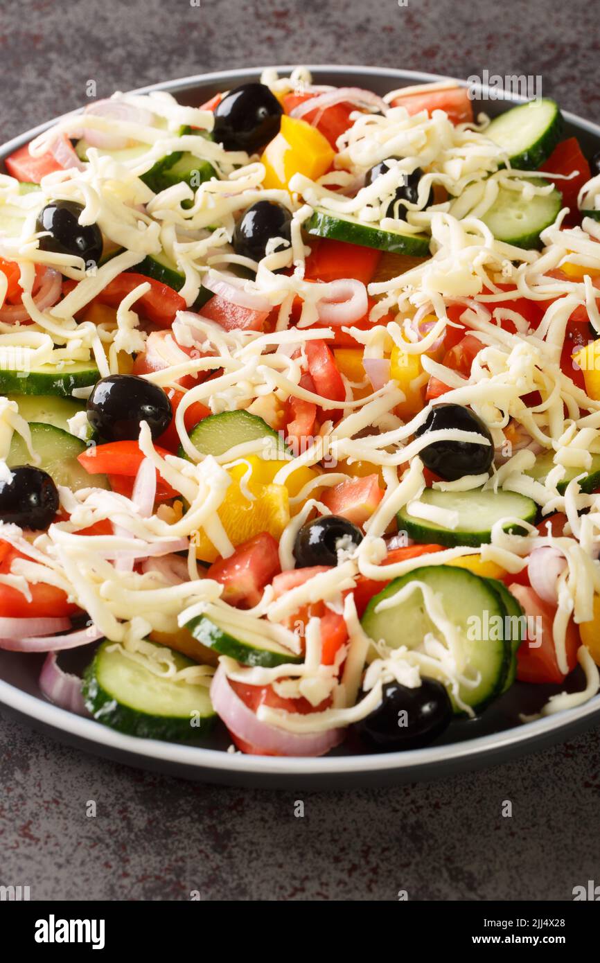 Serbian salad called sopska salata with vegetables and cheese closeup ...