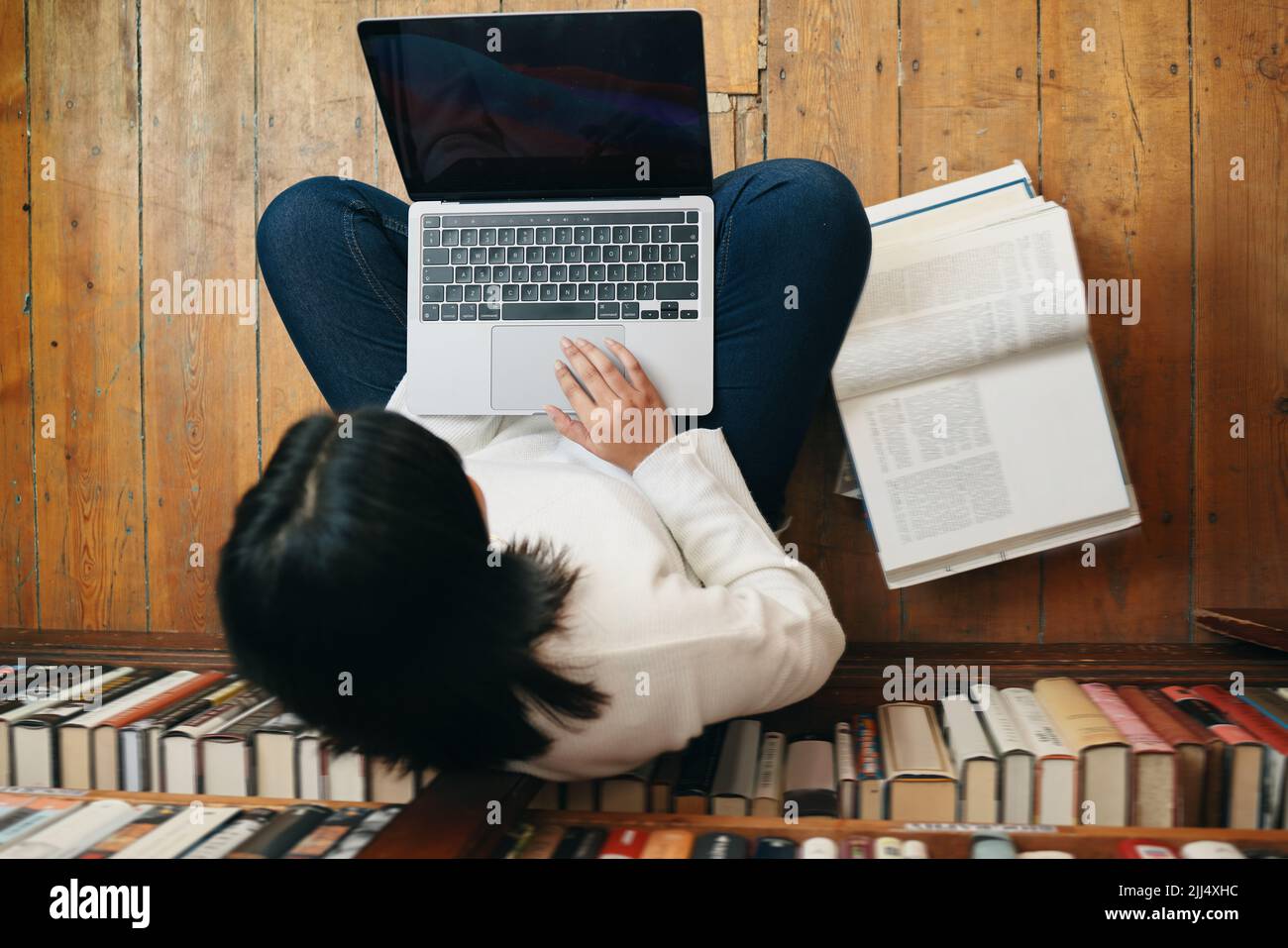 Ready to put in the hard work. a female student working on her laptop ...